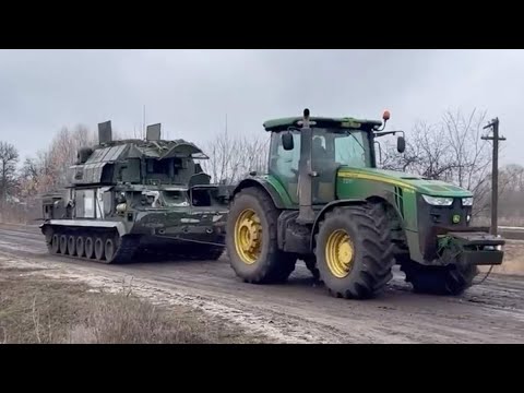 Ukrainian farmers rising against the Russian army // Tows away Russian ...