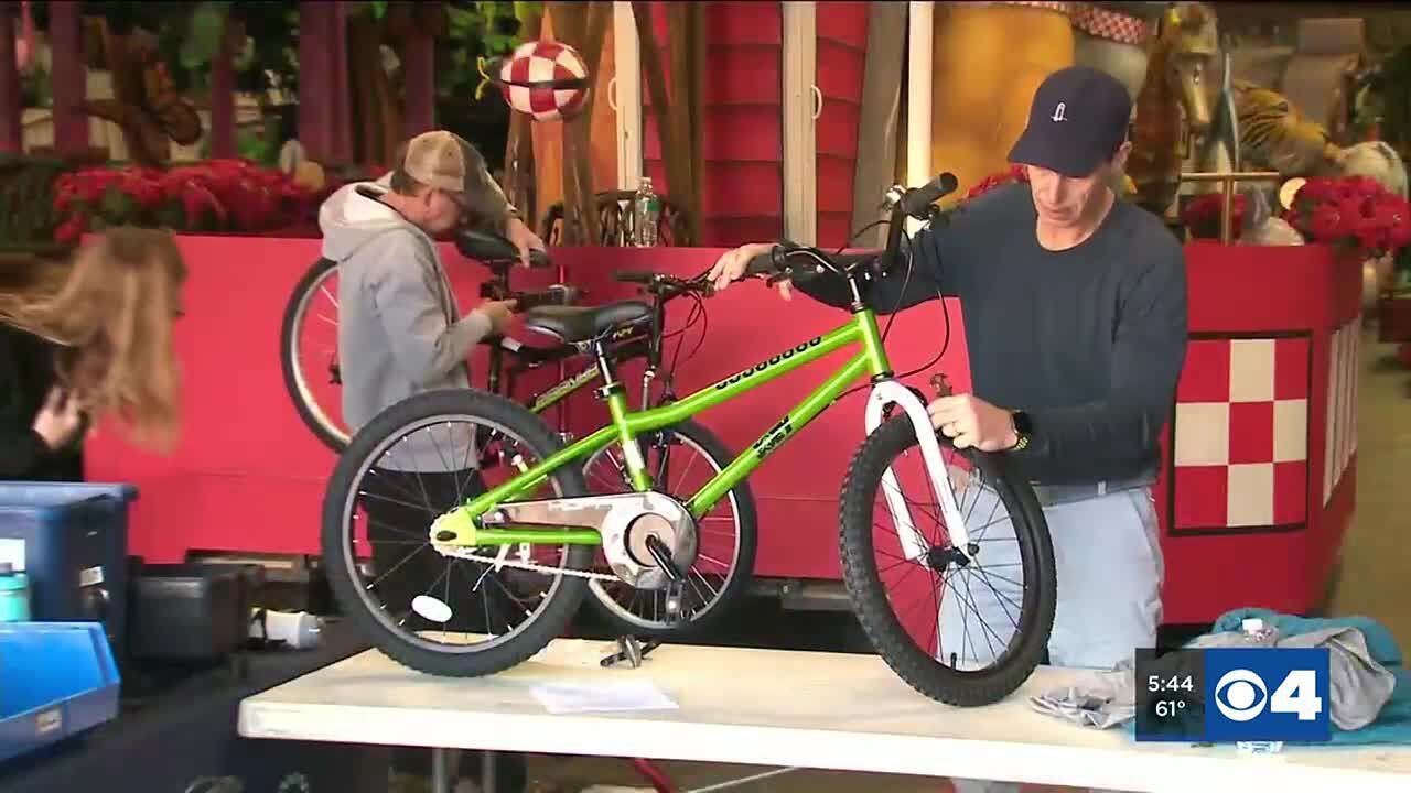 Volunteers assemble, donate bikes for local kids - YouTube