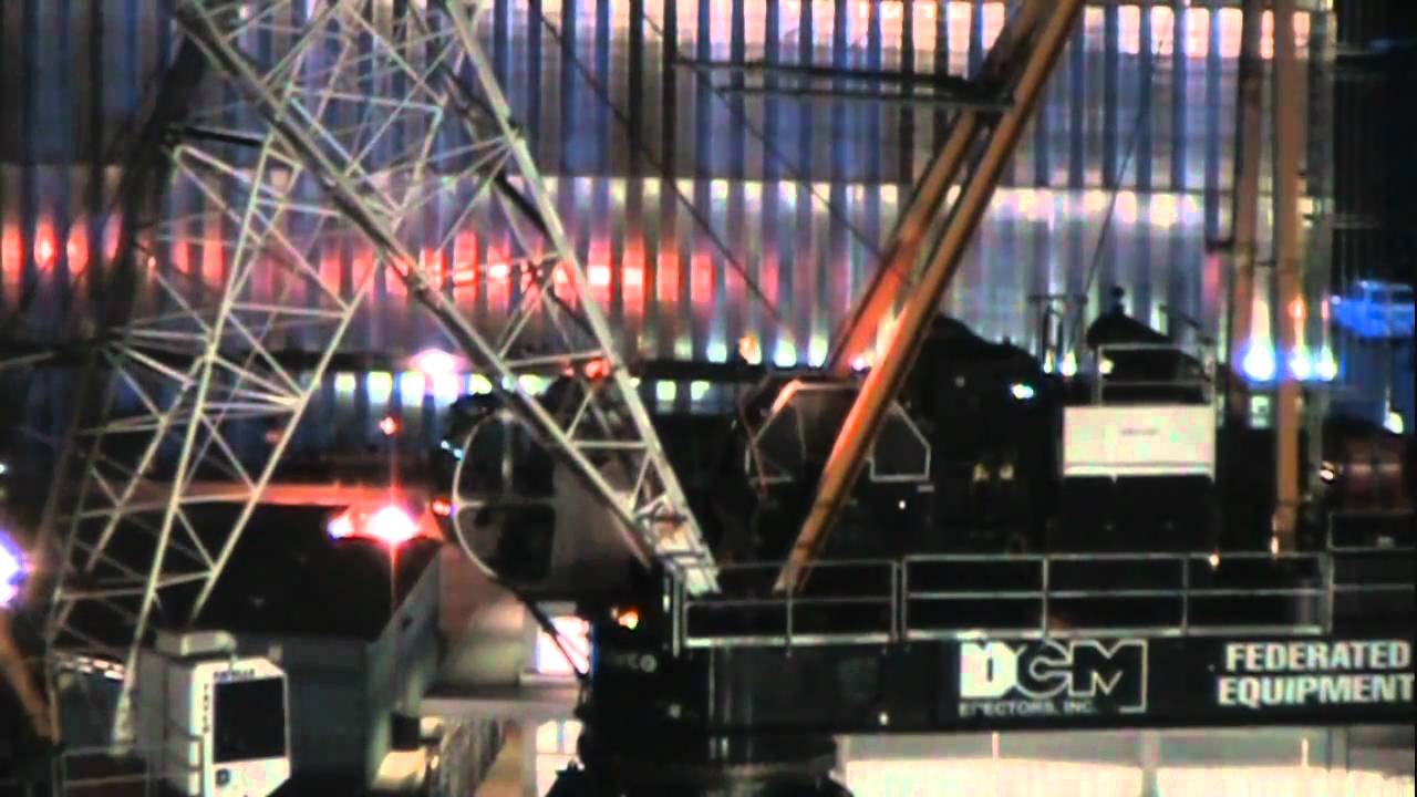 Favco M760D Tower Crane Unloading Massive Steel At Night - YouTube