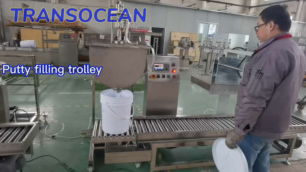 Paint filling trolley & roller capping unit - YouTube