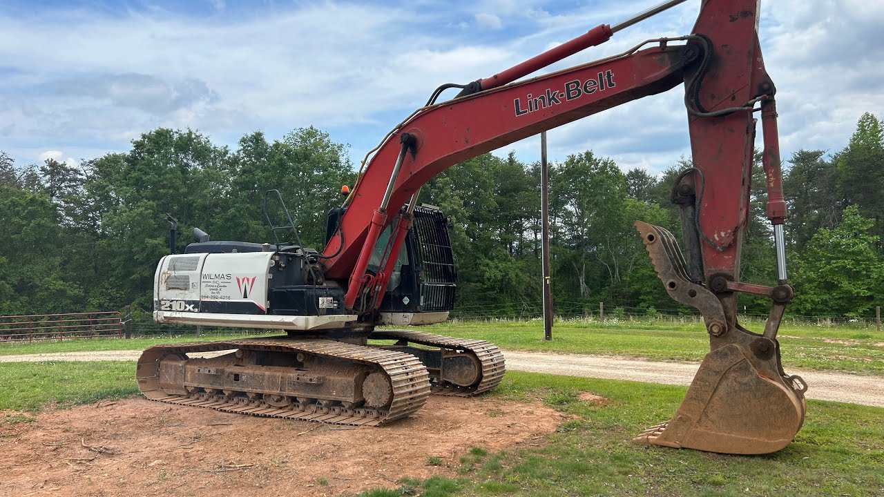 Lowboy truck moving tractor to next project - YouTube