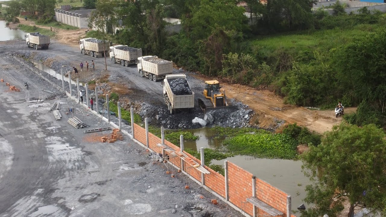 Excellent Techniques skill operator Dozer pushing Rock into the water ...