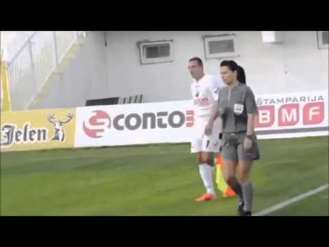 The gorgeous female linesman distracting fans from the action - YouTube