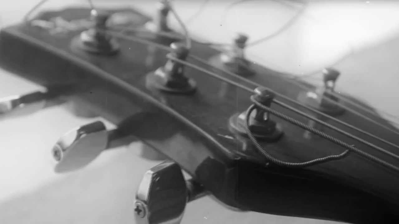 How to Re-String an Acoustic Guitar - YouTube