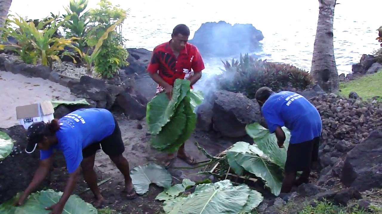 how to put foods in a lovo oven in Fiji - YouTube