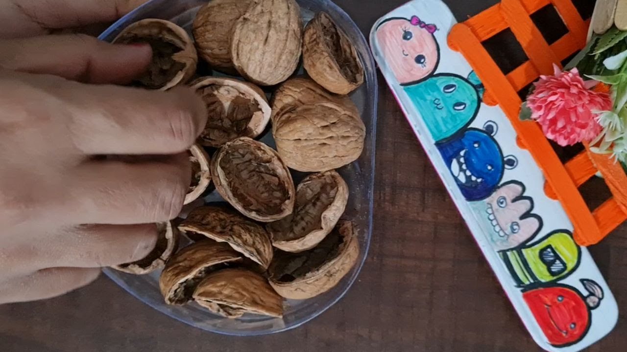 Woman creates fun owl figurine by using walnut and pistachio shells ...