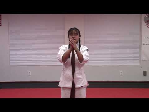 Sarah - How to tie a karate belt @KhasKarate