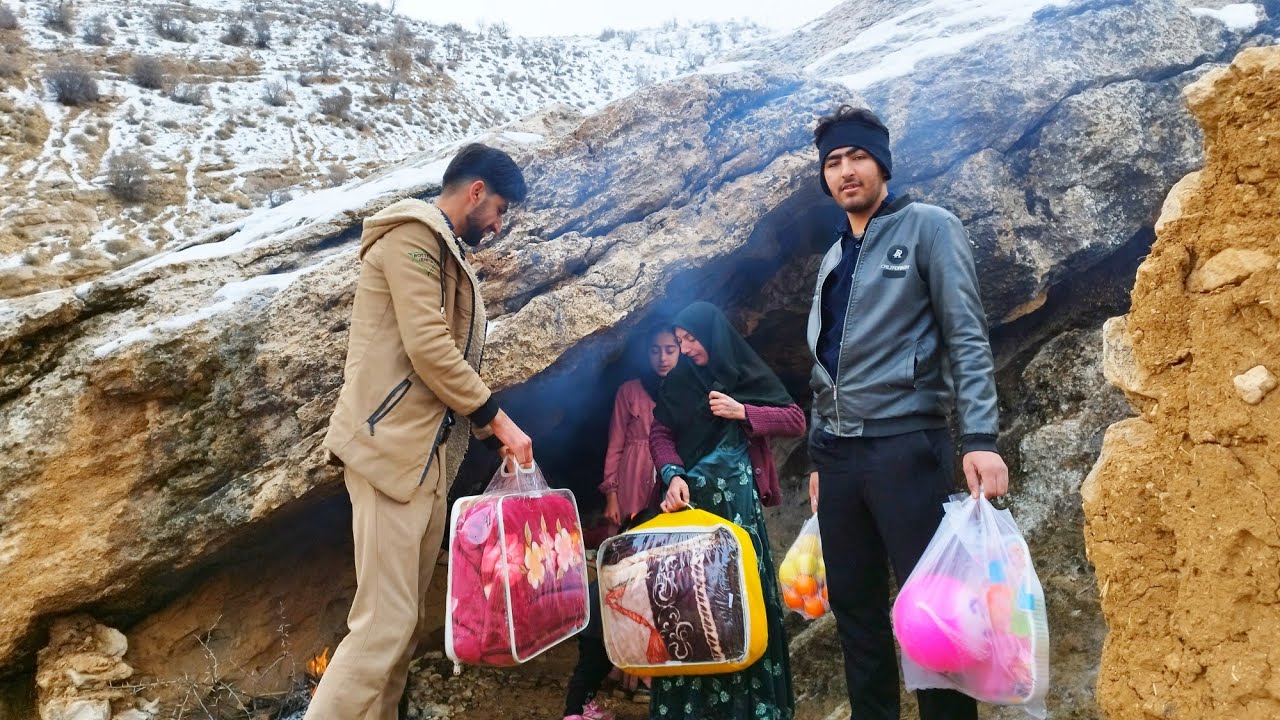 A helping hand of two young men to support the grandmother of orphan ...