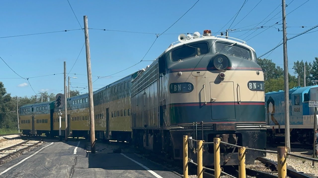 CNW Bi-level train departs Illinois railway Museum with BN 3 E9A at the ...