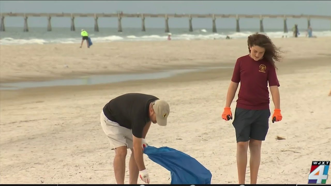 Volunteers tackle local beach cleanup - YouTube