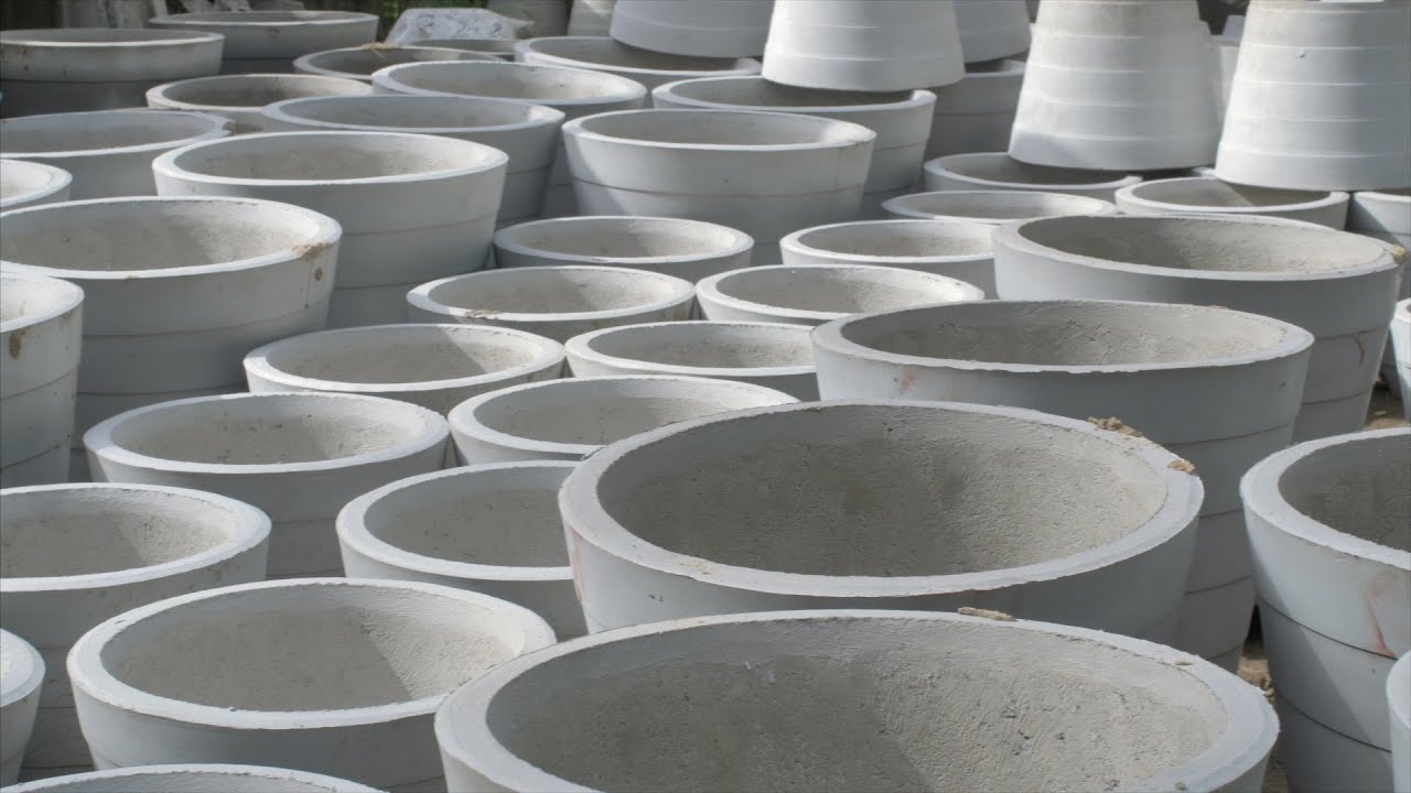 Pan shot of ready cement planters (Gamla) kept for selling | Indian ...