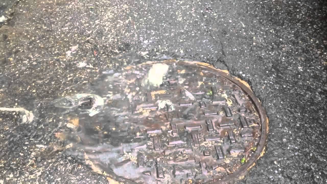 Sanitary Sewer Manhole Overflowing during heavy rain - YouTube