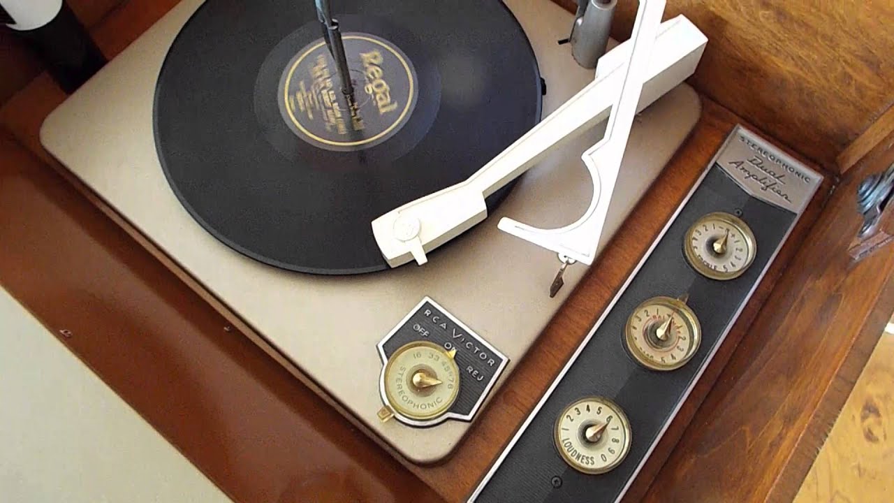 RCA stereo automatic record player playing a 78 RPM, 10 inch record ...