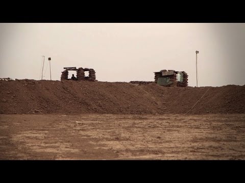 Iraq's Kurds build berm in desert near mosul - YouTube