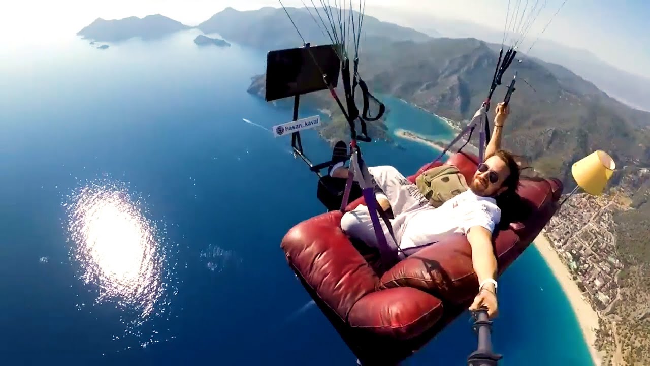Guy Paraglides With Sofa and TV Set - YouTube