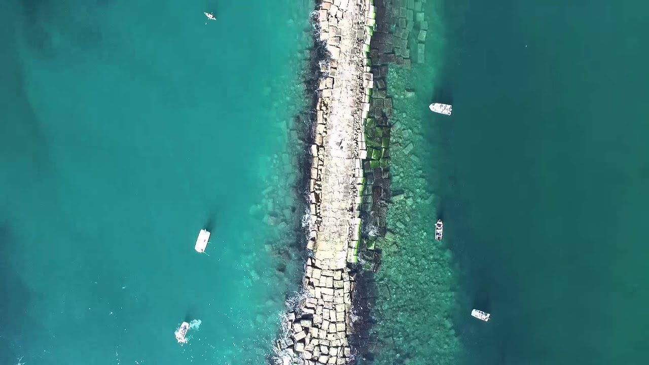South Padre Island jetties ultra clear water drone view - YouTube
