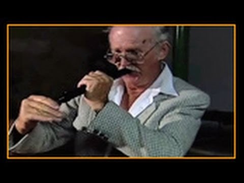 Musician playing on a slide whistle - YouTube