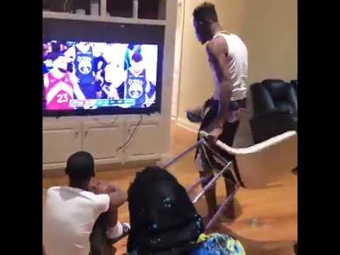 Angry man destroys his television after losing bet
