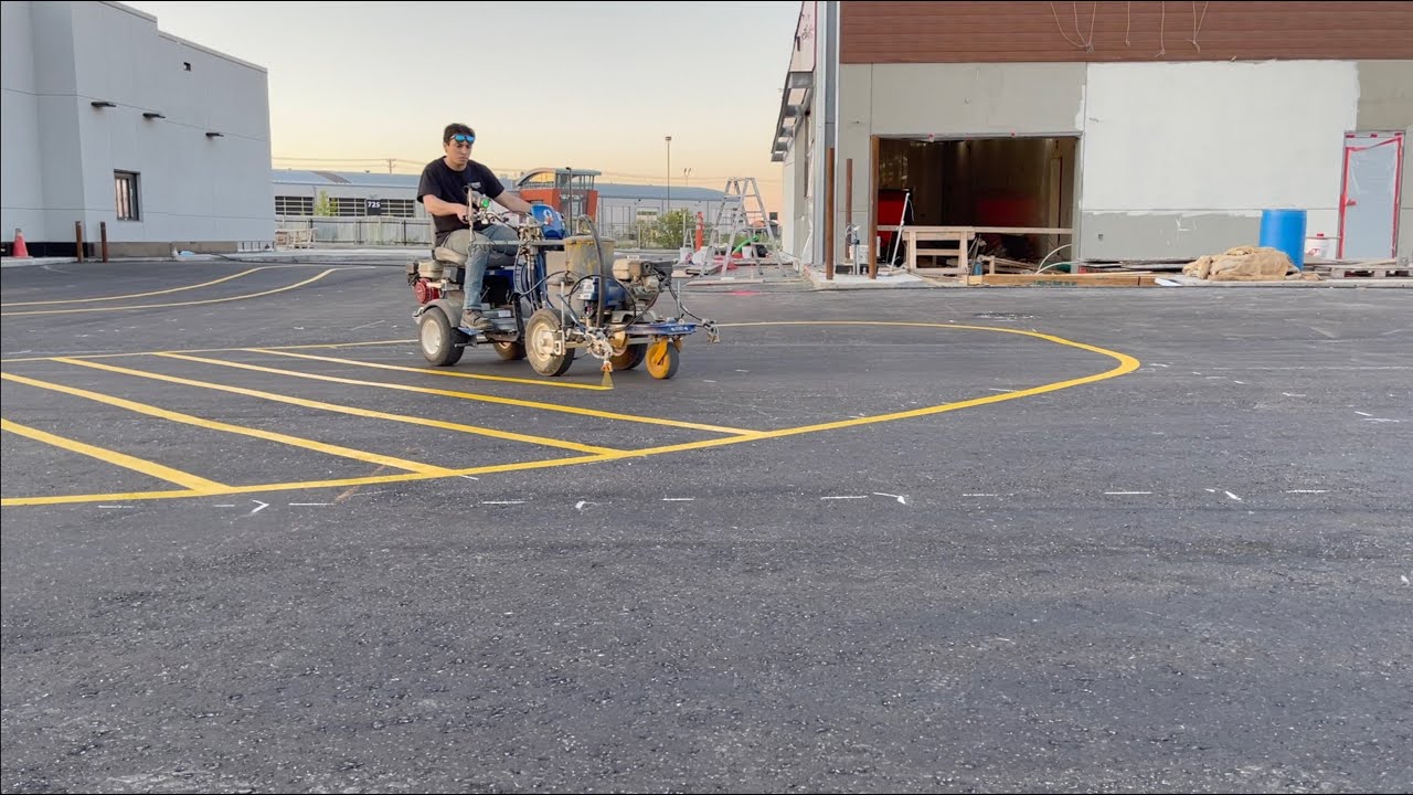 Striping cross hatching on new asphalt - YouTube
