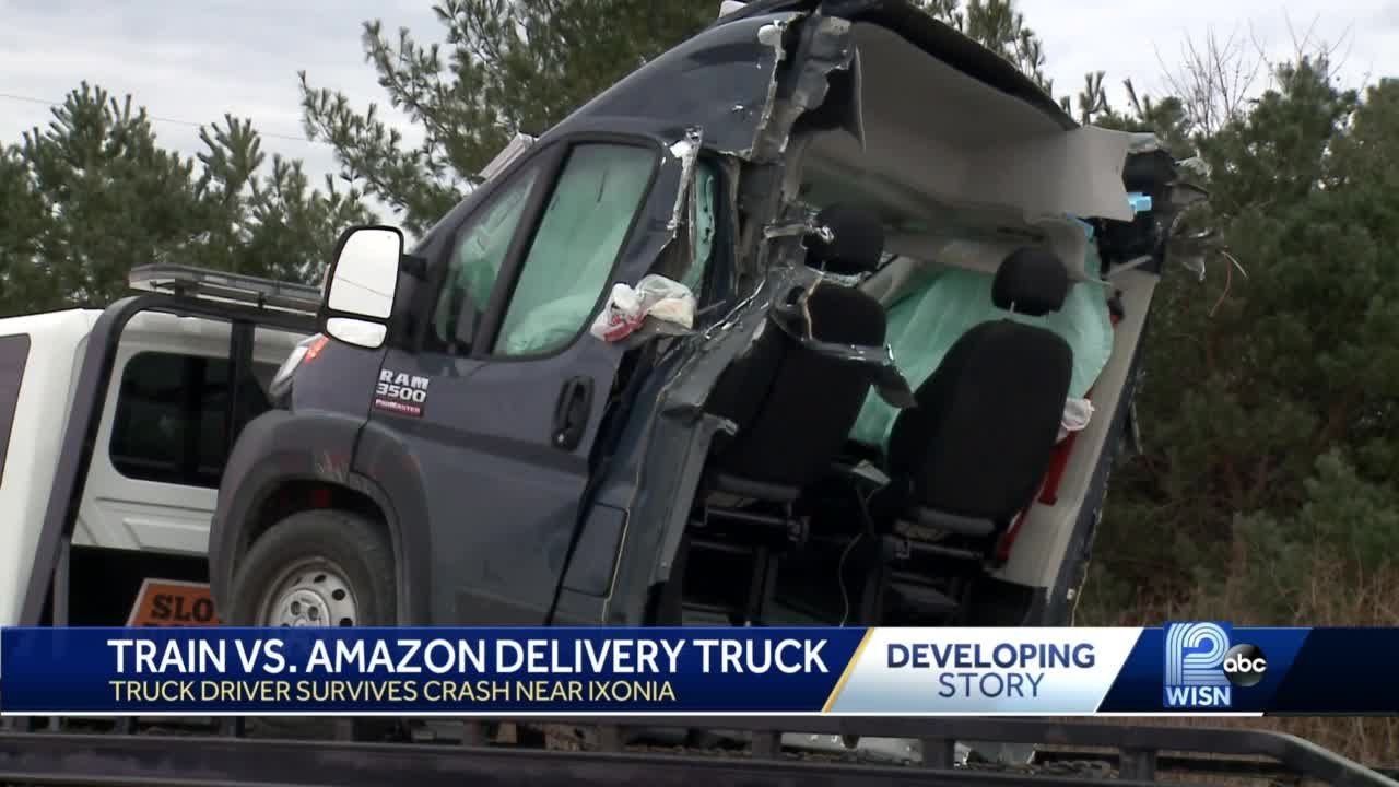 Train strikes Amazon delivery truck - YouTube