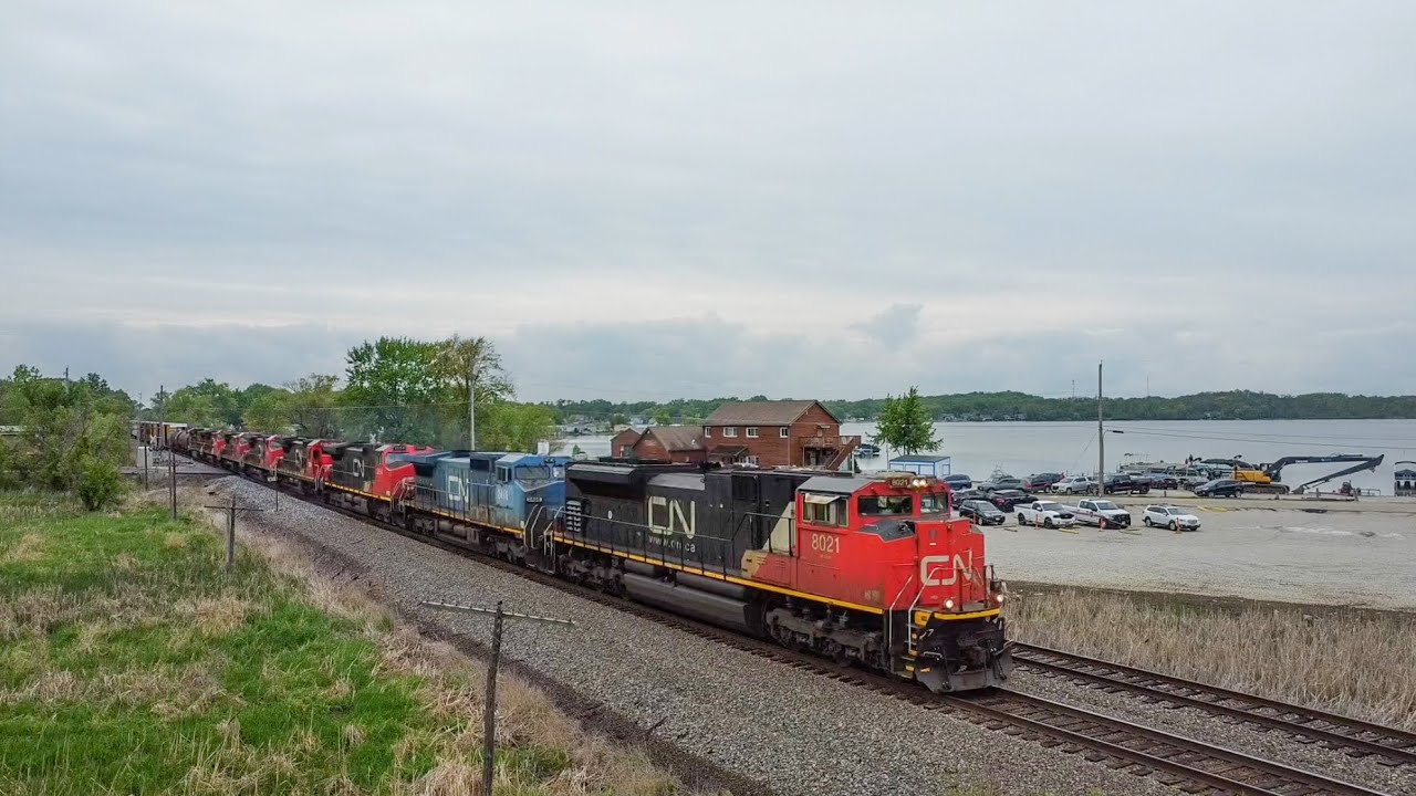 CN 8021 leads a 8 locomotive lash up with 5 dash 8s DIT through silver ...