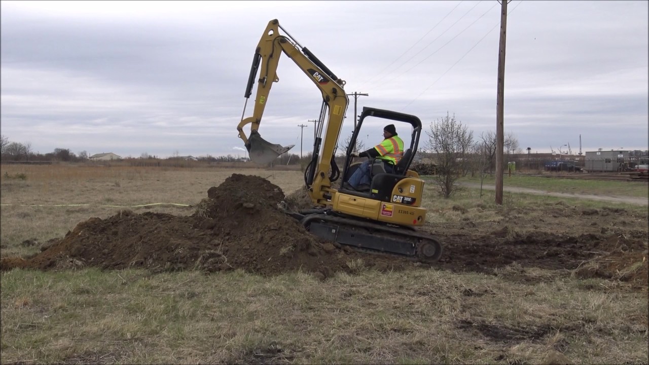 Moving Dirt with Cat 305E Mini-Excavator and Case 450 Tracked Loader ...