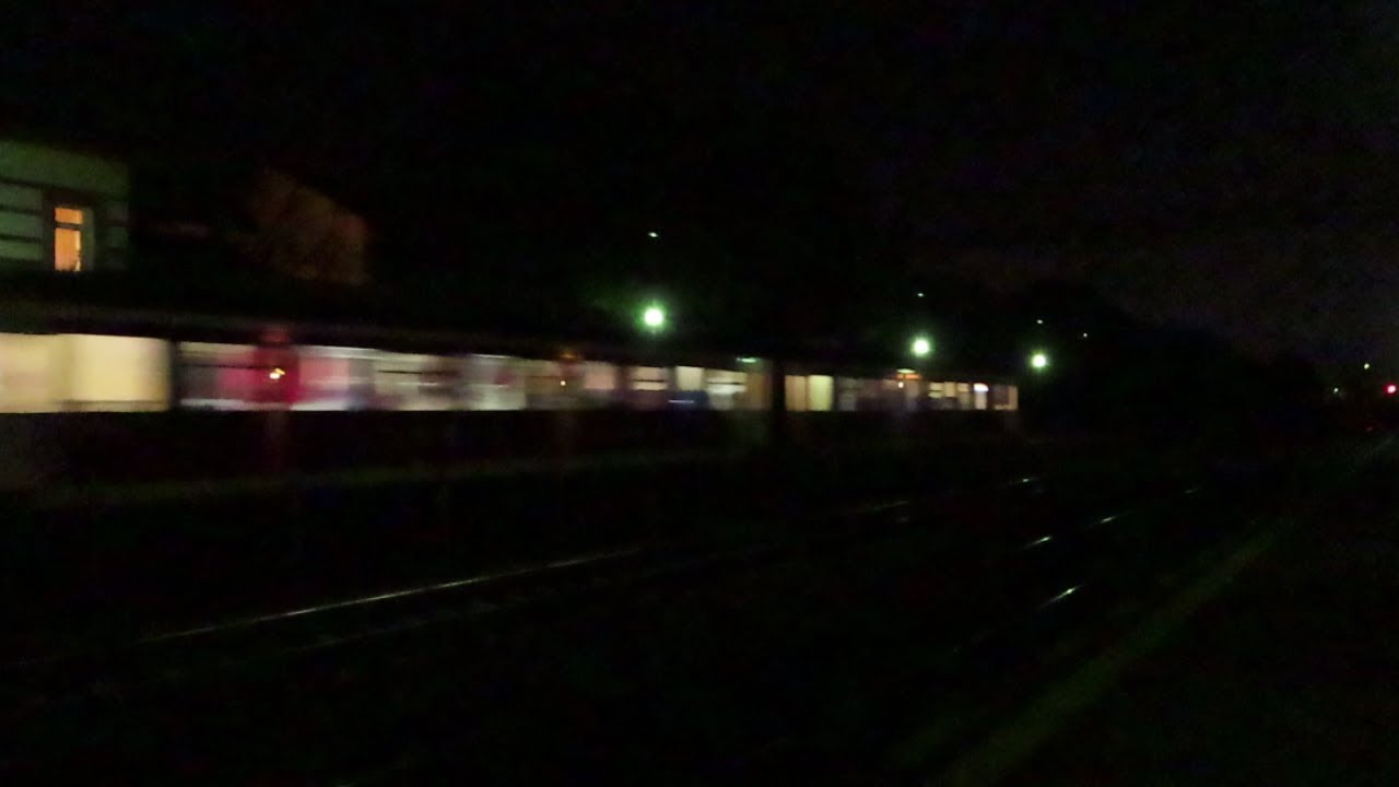 Romania: A Transferoviar Calatori multiple unit passes Chitila on a ...