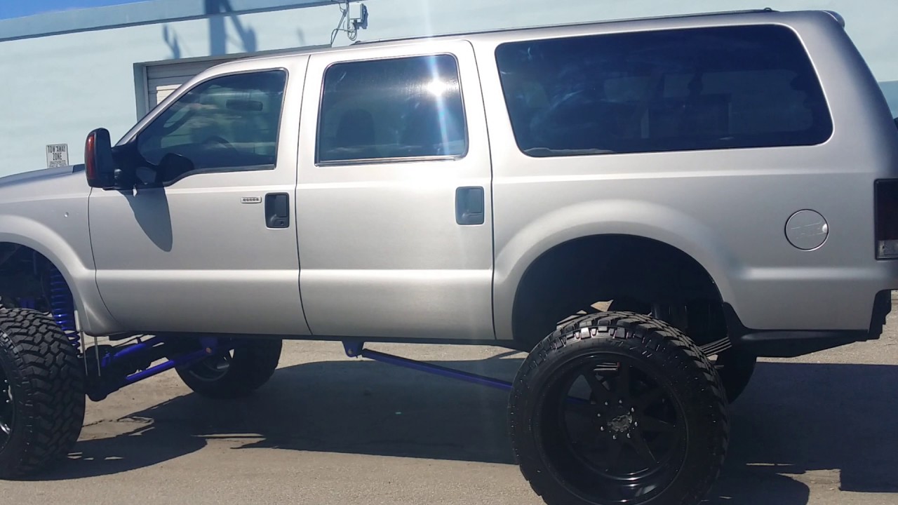 Wrapped in brushed stainless steel ford Excursion - YouTube