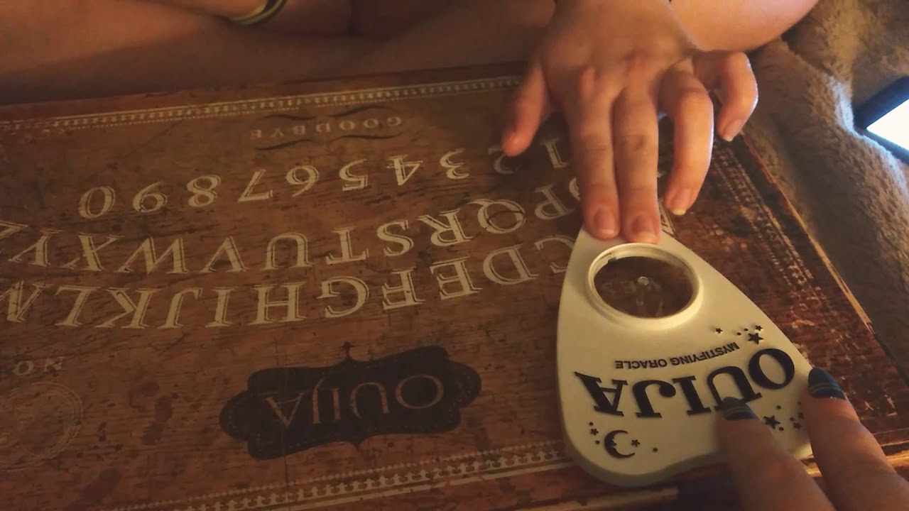 PLAYING WITH THE OUIJA BOARD - YouTube