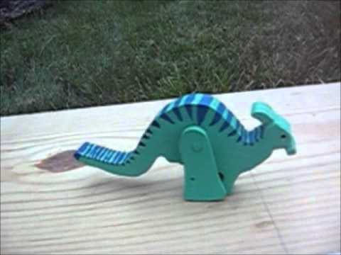 Hopping wood dinosaur toy - YouTube