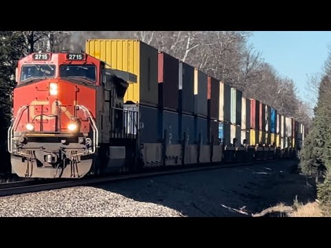 CN 2715 Q198 leads Southbound intermodal with loud SD70M-2 as rear DPU. MP 437.7 in Bennett, WI ...