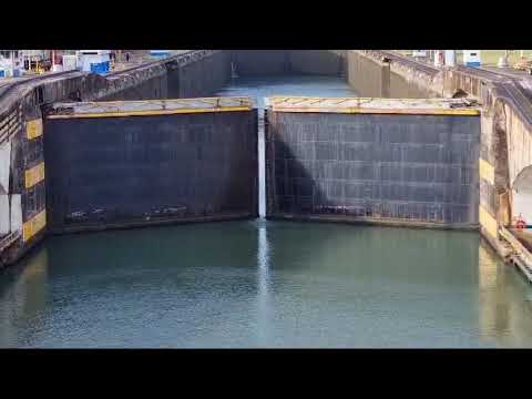 Panama Canal gates opening at one of the locks, allowing the ship to go ...