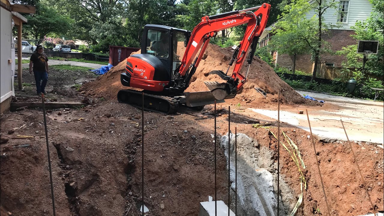 Backfilling Cured Foundation and Preparing for Footers - YouTube
