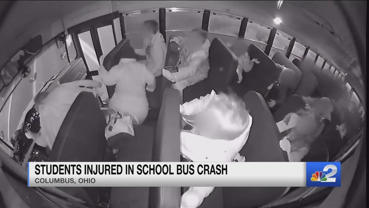 Driver running red light causes school bus to roll over in crash - YouTube