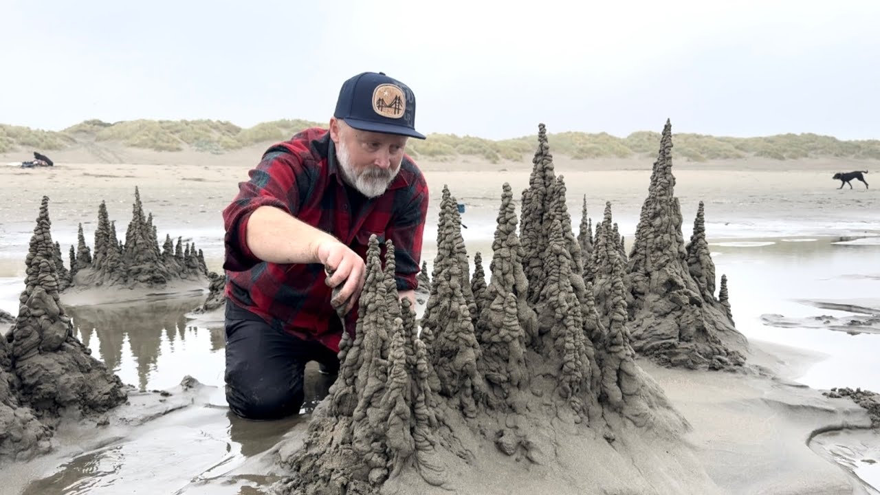 Building a sandcastle at the beach then filming it getting destroyed by ...