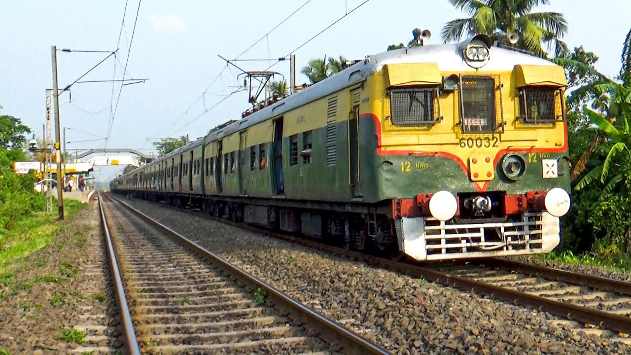 Electric Multiple Unit Local Train at afternoon with a lot of homebound ...