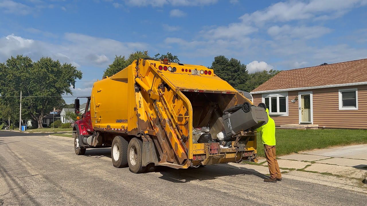 City of Watertown yellow International loadmaster rear loader garbage ...