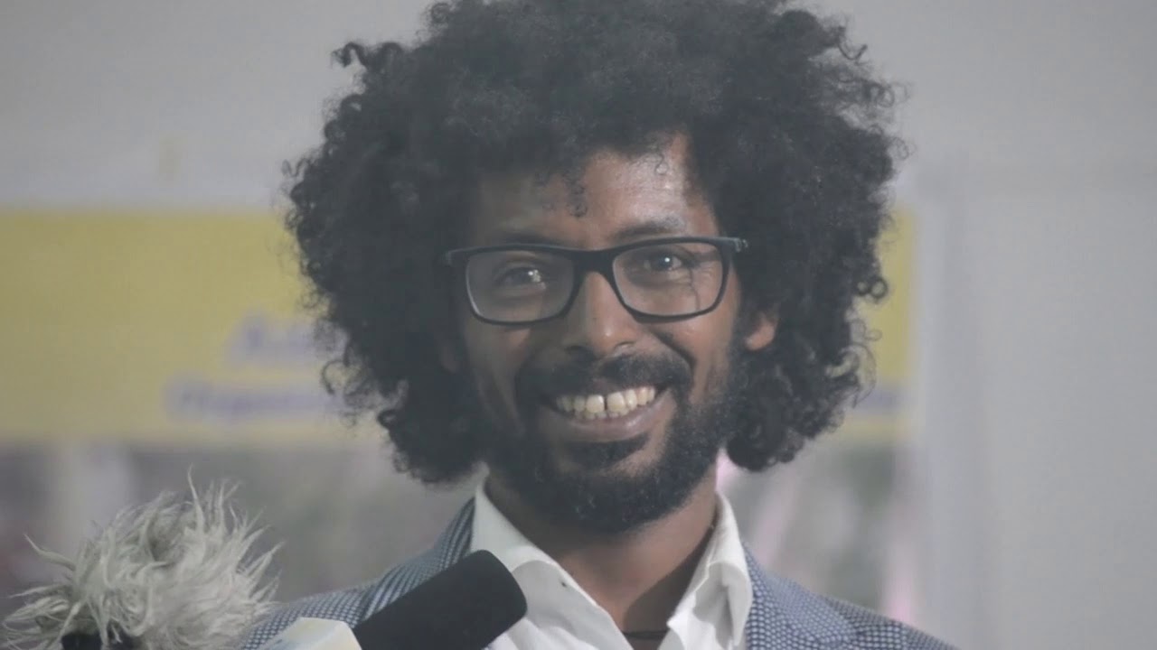 Melaku Belay Speaking to the Press about Azmari Festival መላኩ በላይ - YouTube