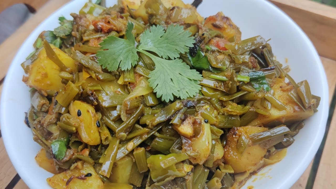 A plate full of singre ki sabzi, bursting with flavors and vibrant ...