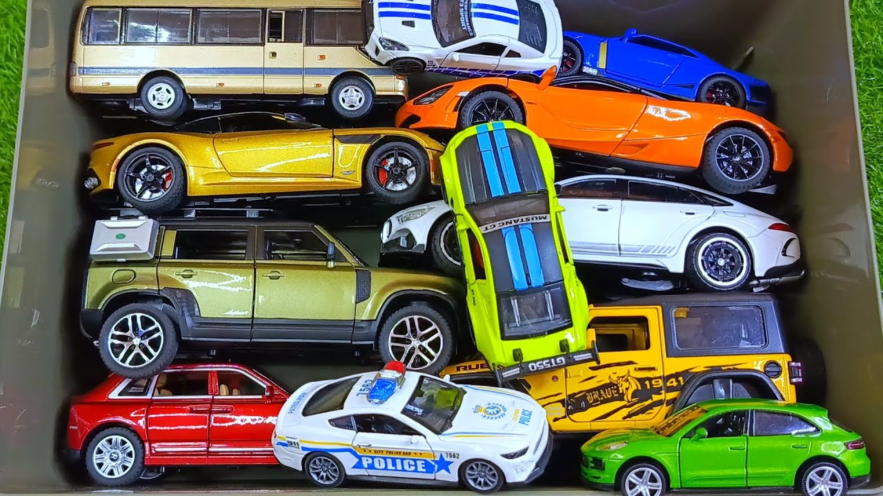 Box full of various miniature cars Jaguar, Peugeot, Renault, Hyundai ...