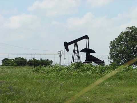 Oil Well With Hesston Sentry Pumping Unit - YouTube