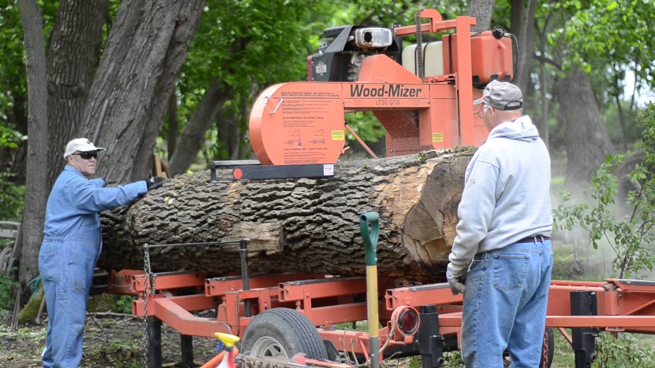 Wood-Mizer second cut of large Ash tree - YouTube