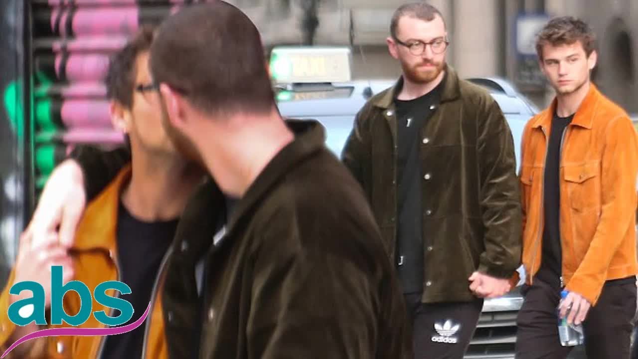 Sam Smith locks lips with beau Brandon Flynn in Barcelona | ABS US ...