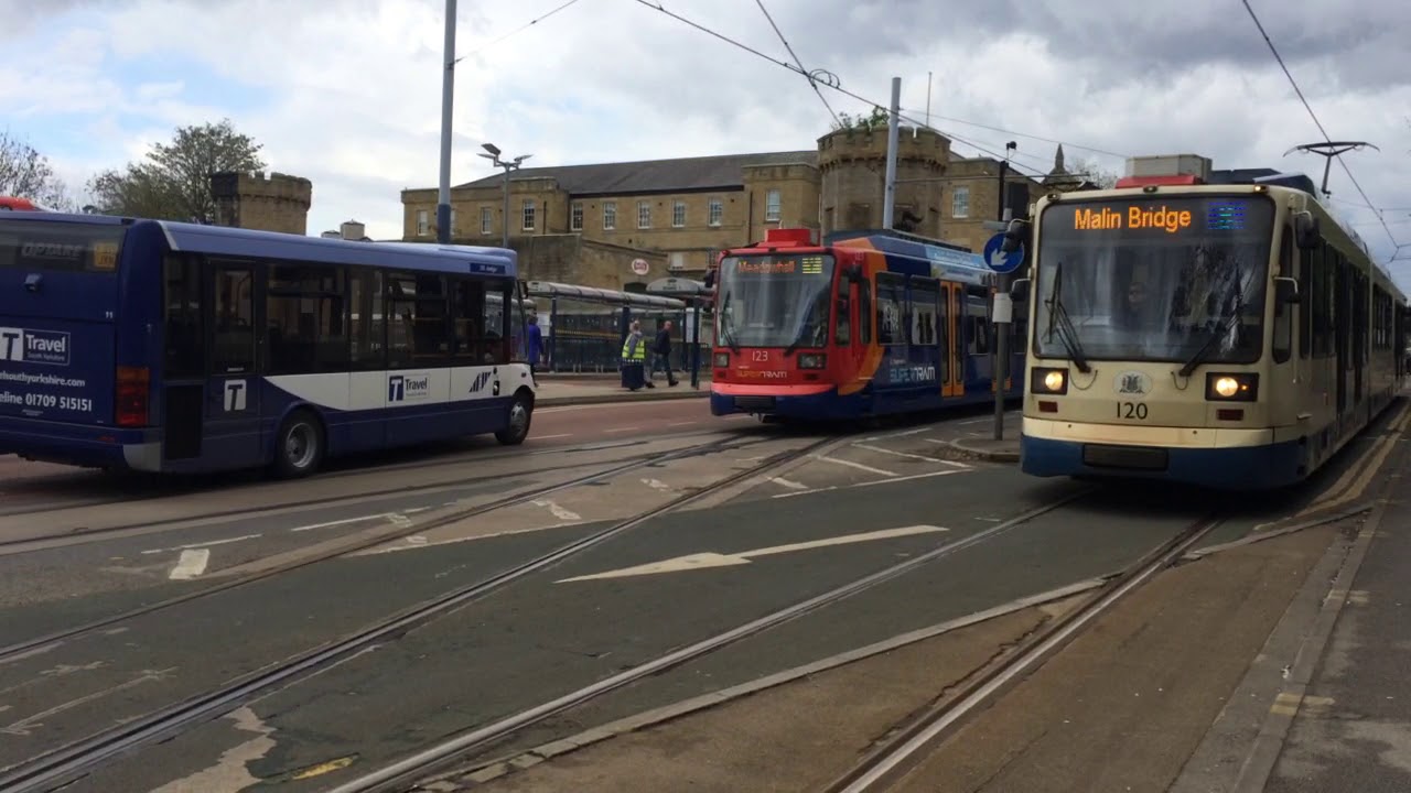 Sheffield Supertram 123 departs while Tram 120 arrives into ...