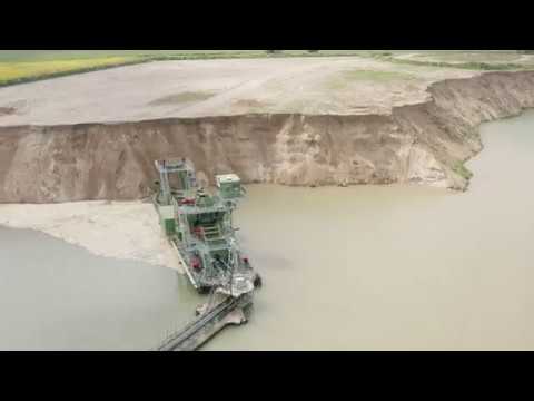 Floating Bucket Ladder Dredger - YouTube