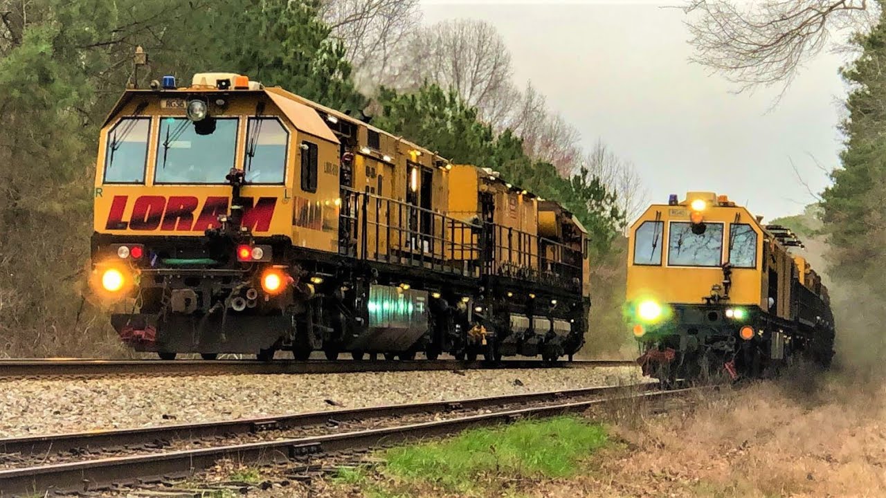 Rare! LORAM Rail Grinder Shoves Railcars! - YouTube