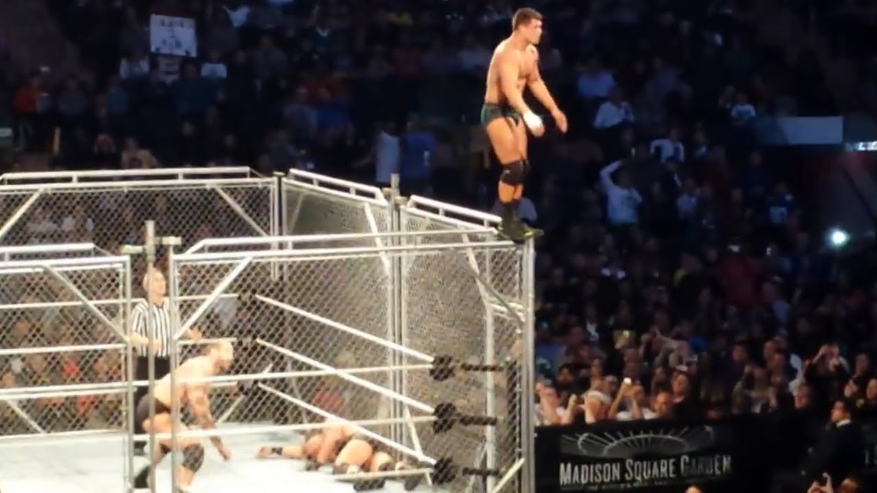 Cody Rhodes moonsaults from the top of the cage | 12/26/13 | MSG | WWE ...