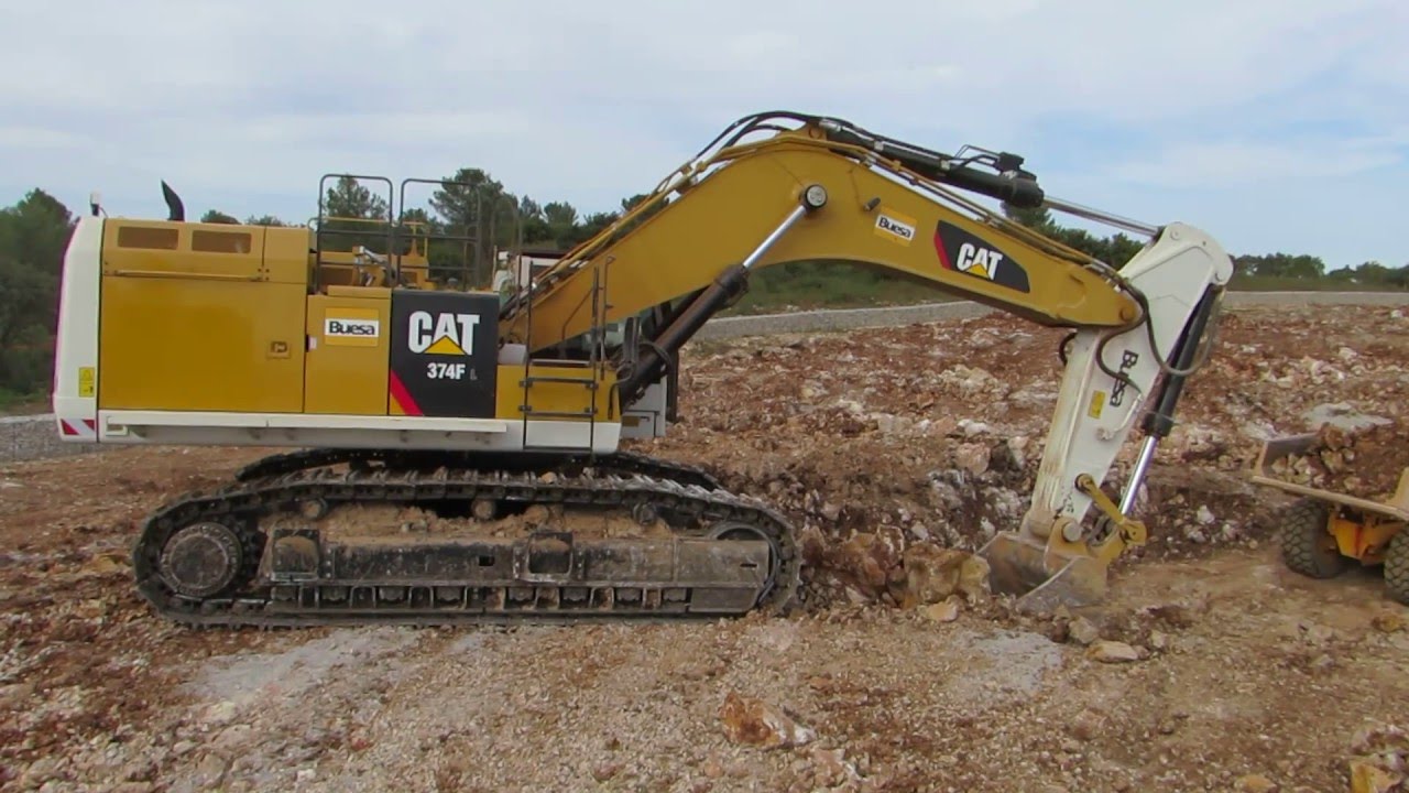 Caterpillar 374F loading Volvo A25G - Part 2 - YouTube