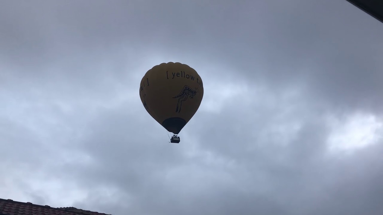 Hot air balloon flies over our house - YouTube