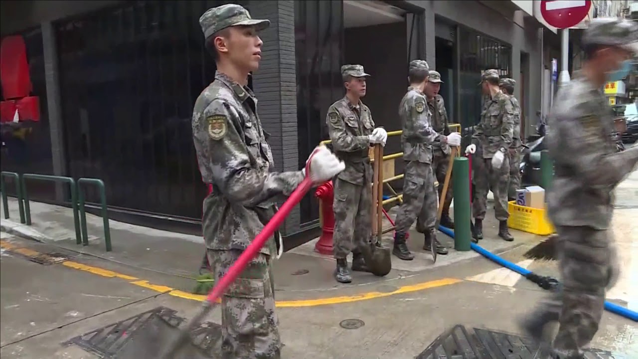 PLA troops in Macao help with disaster relief after typhoon Hato - YouTube